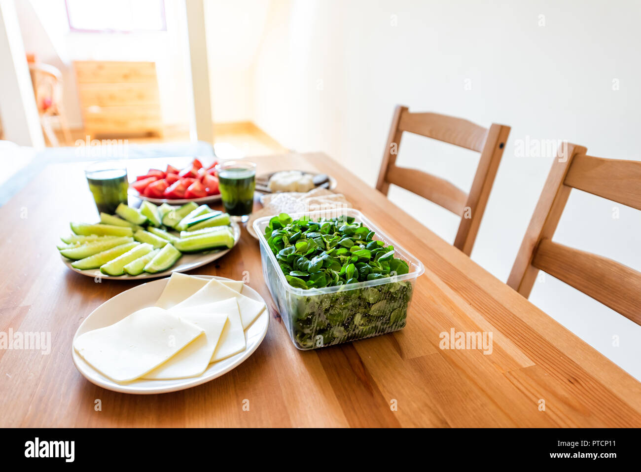 Wooden table setting of healthy vegan vegetarian lunch, green ...