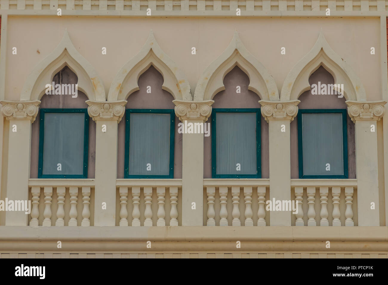 Row of arch windows on the balcony with stucco wall background Stock ...