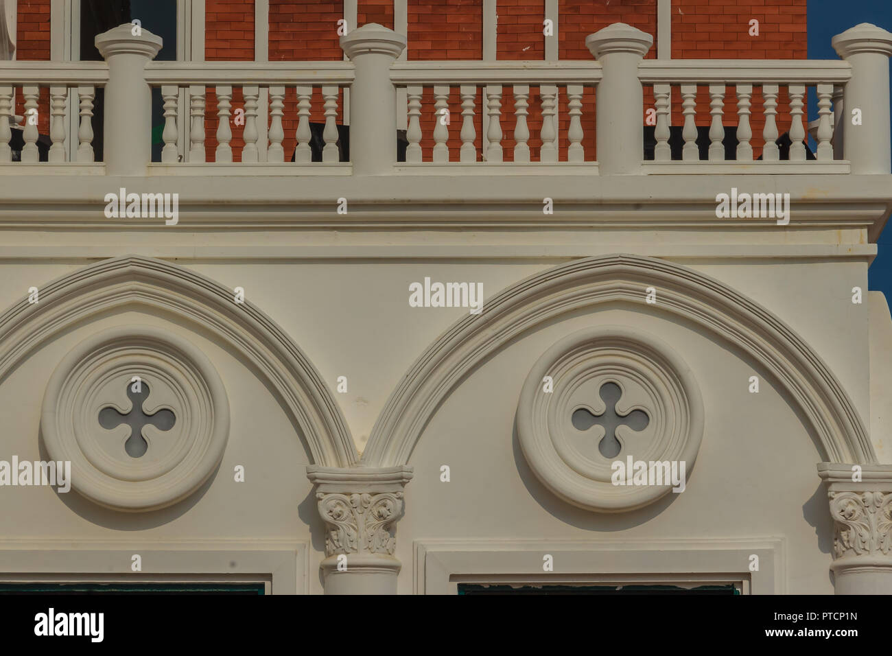 Abstract French balconies which decorated in circle shape above arch ...
