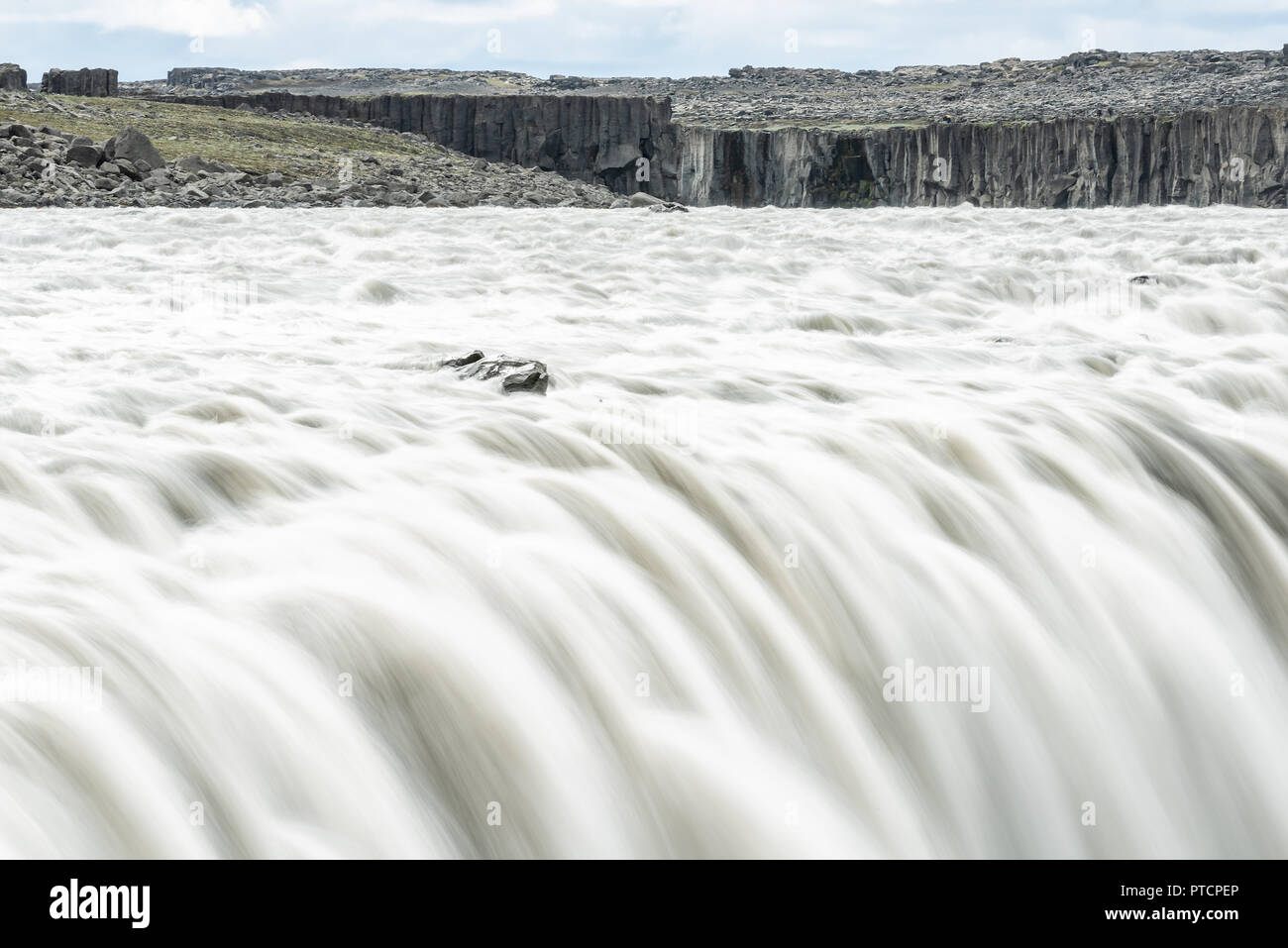 Iceland Dettifoss waterfall closeup, gray grey water, rocky cliff and ...