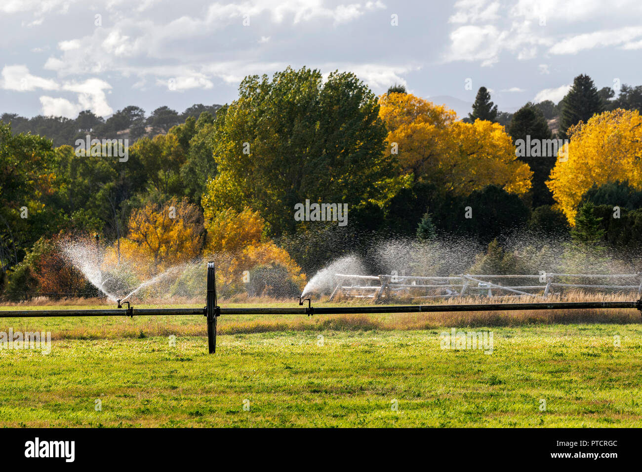 Irrigation equipment spraying water on farm fields near Salida ...