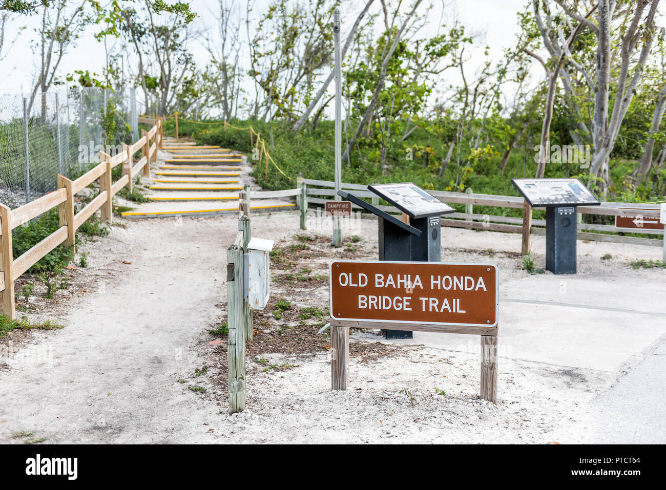 Sign for Old Bahia Honda Bridge Trail in state park during day sunset ...