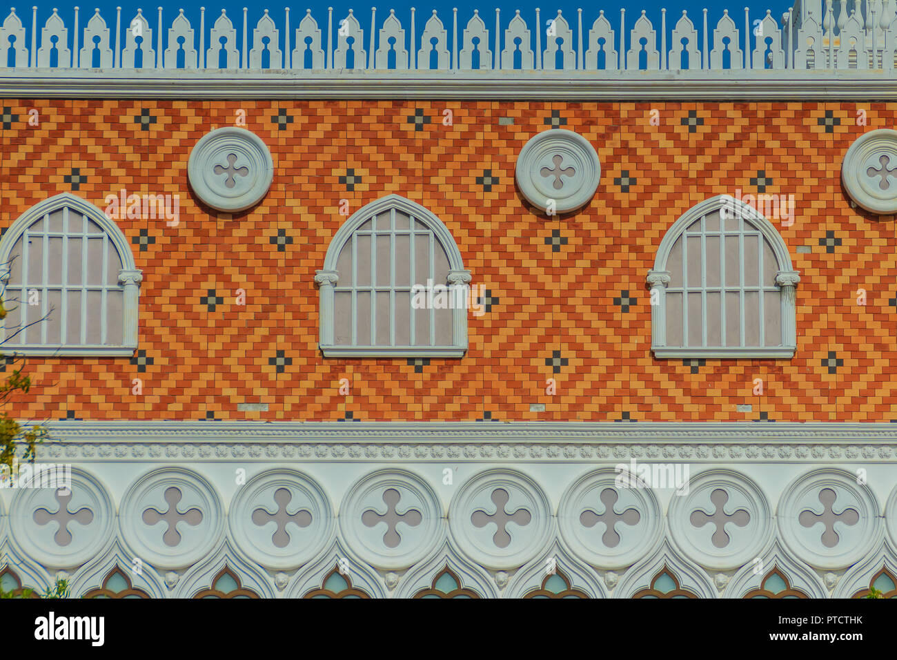 Abstract art of balconies which decorated in circle shape above arch ...