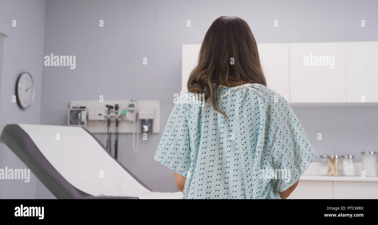 Woman hospital gown waiting hi-res stock photography and images - Alamy