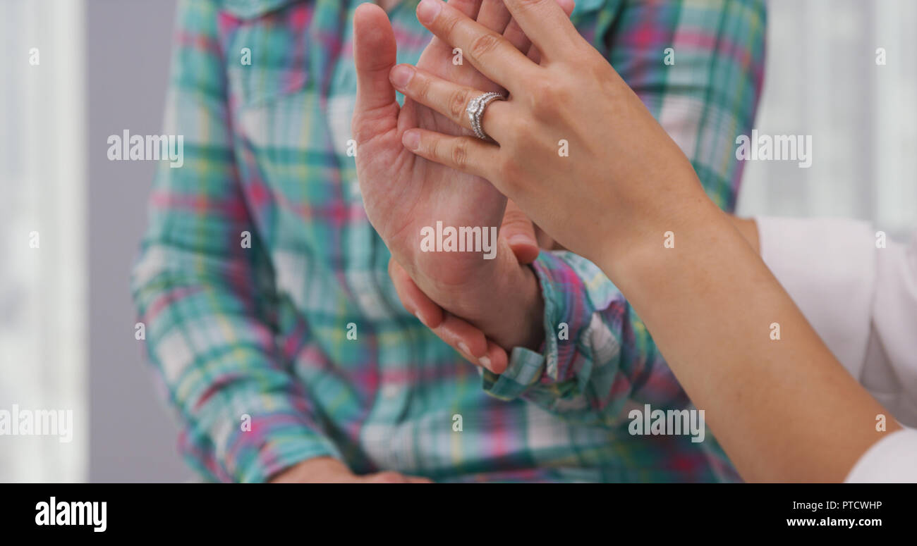 Attractive doctor examining patients hi-res stock photography and ...