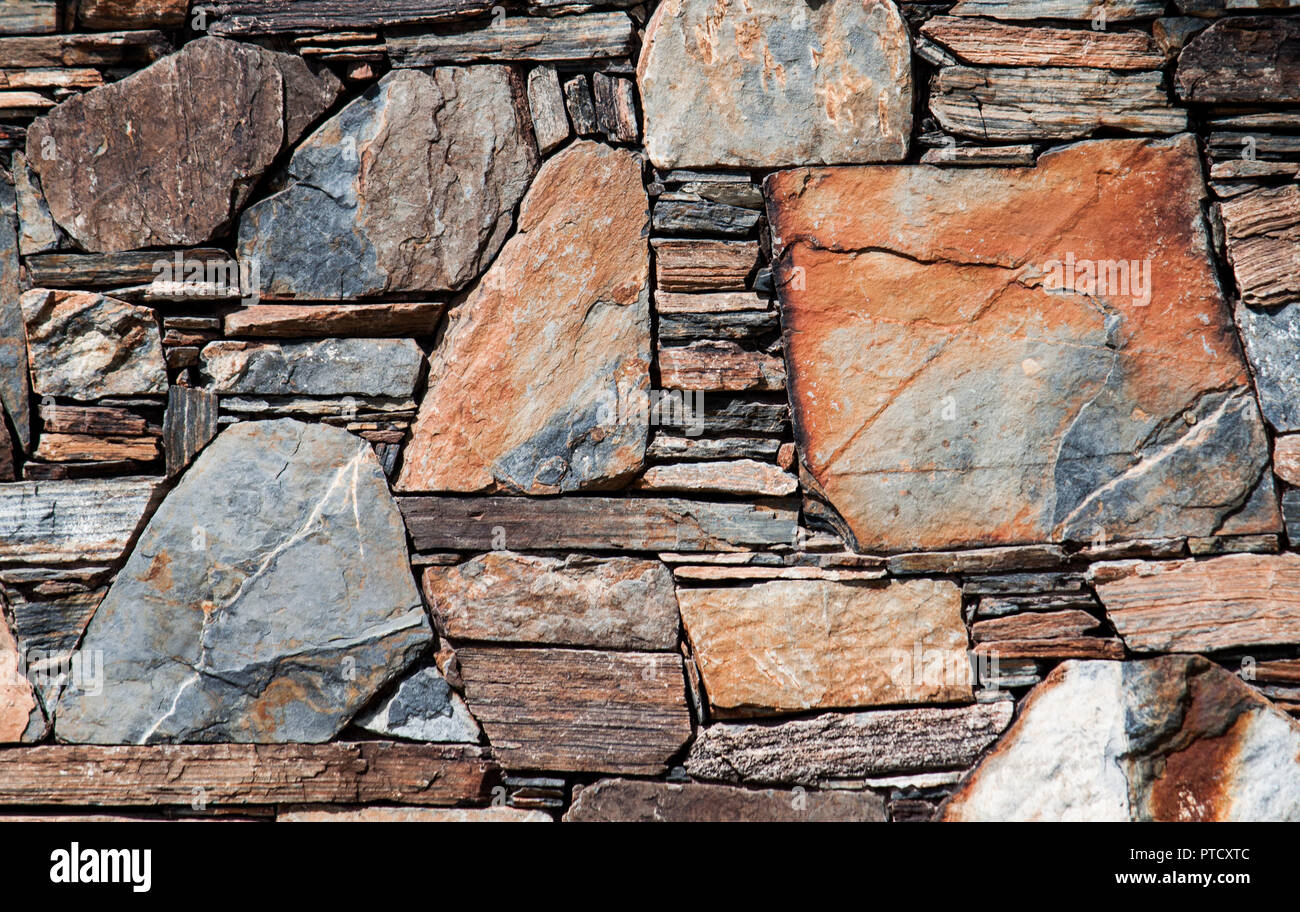 colorful stacked stone wall textured background Stock Photo - Alamy