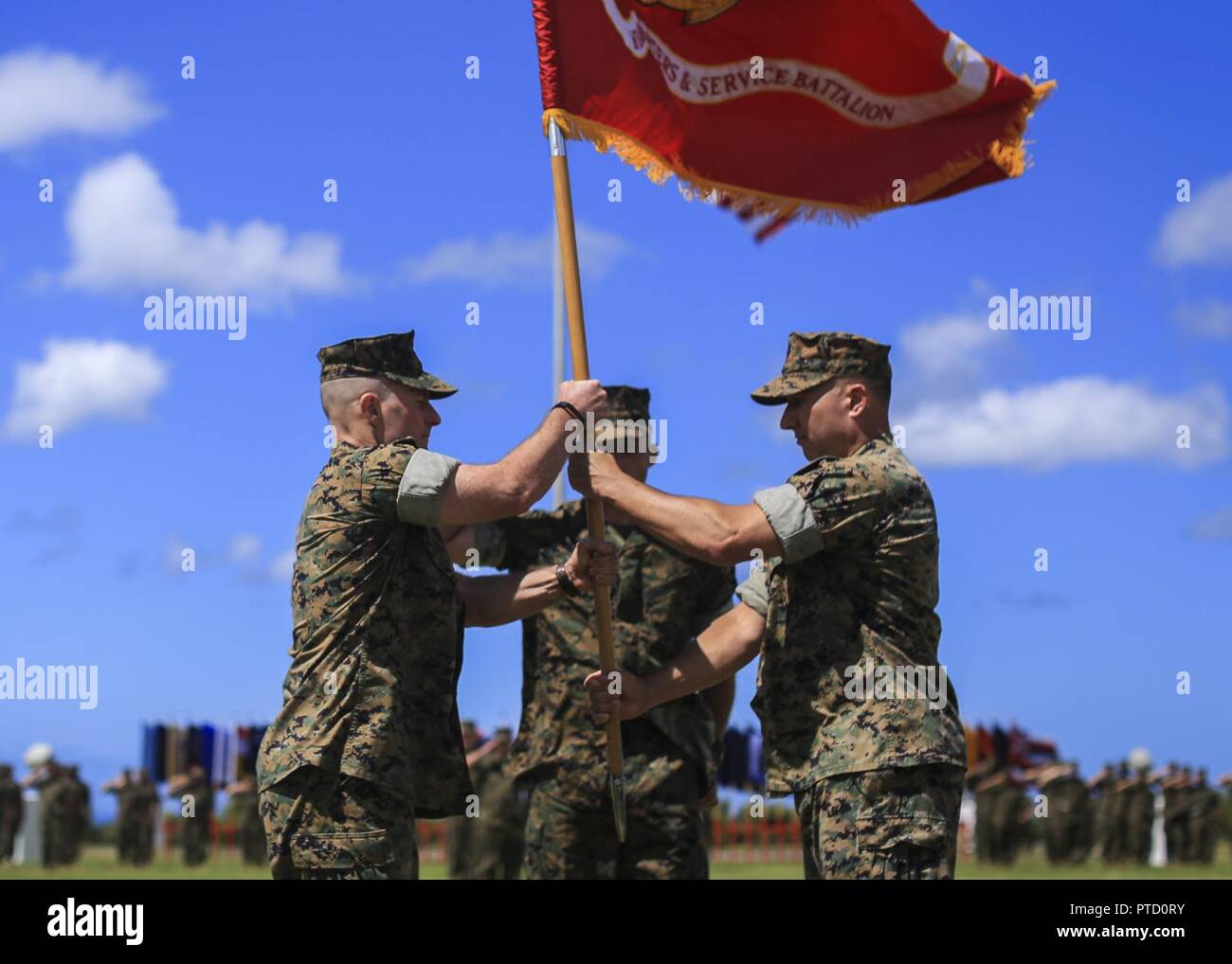 Col. Peter Gadd, right, passes the organizational colors to Col. Keith ...
