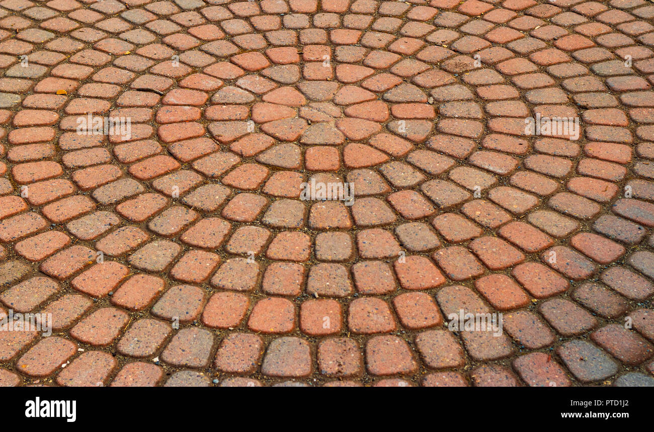 Red circular paved bricks with dirty moss and worn age Stock Photo - Alamy
