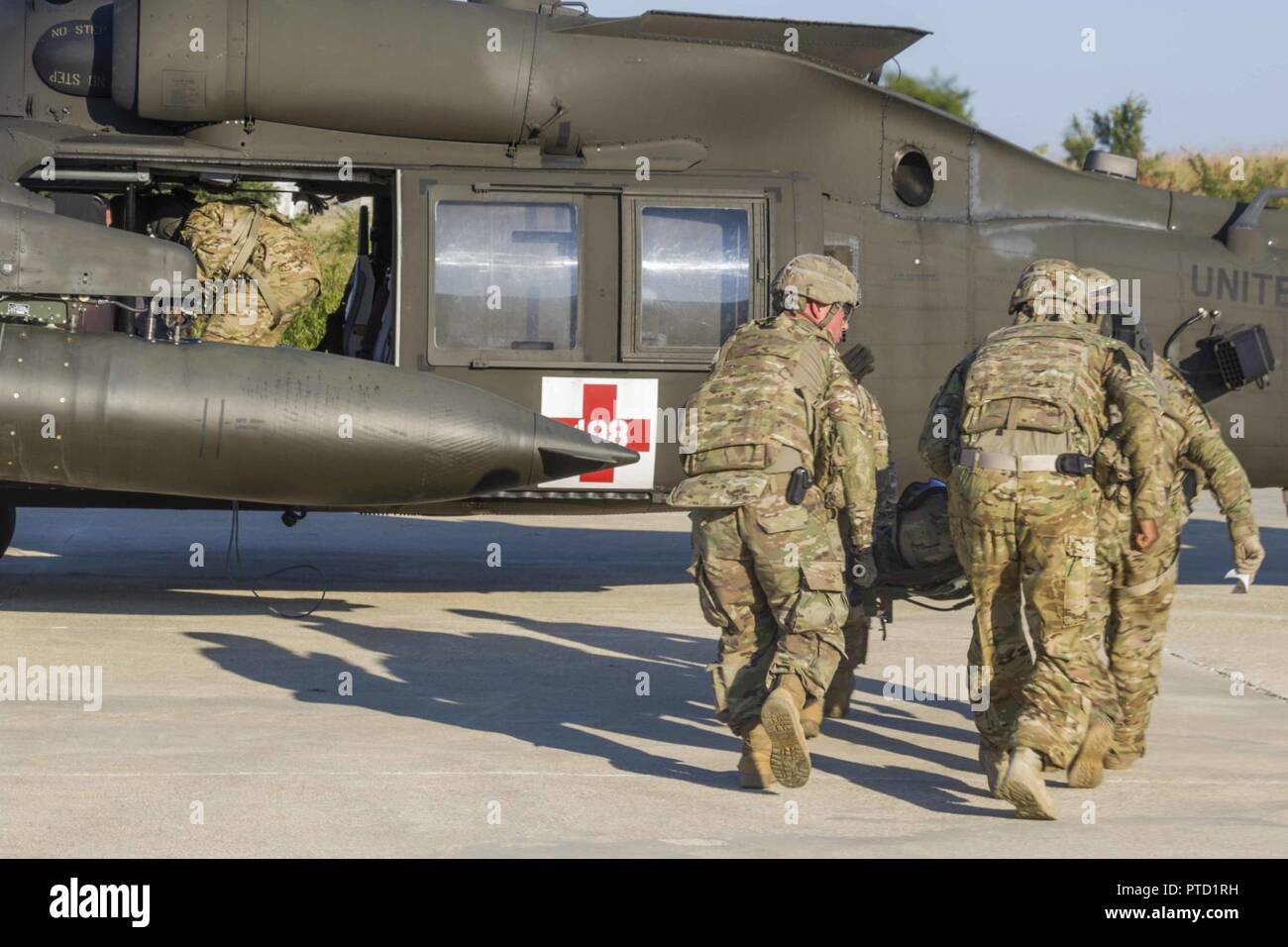 Soldiers from 277th Aviation Support Battalion carry a simulated ...