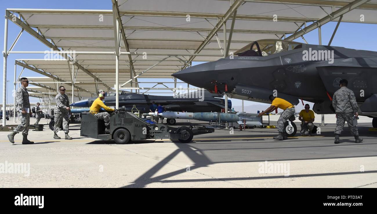 Members of the 61st Aircraft Maintenance Unit load crew team prepare to ...