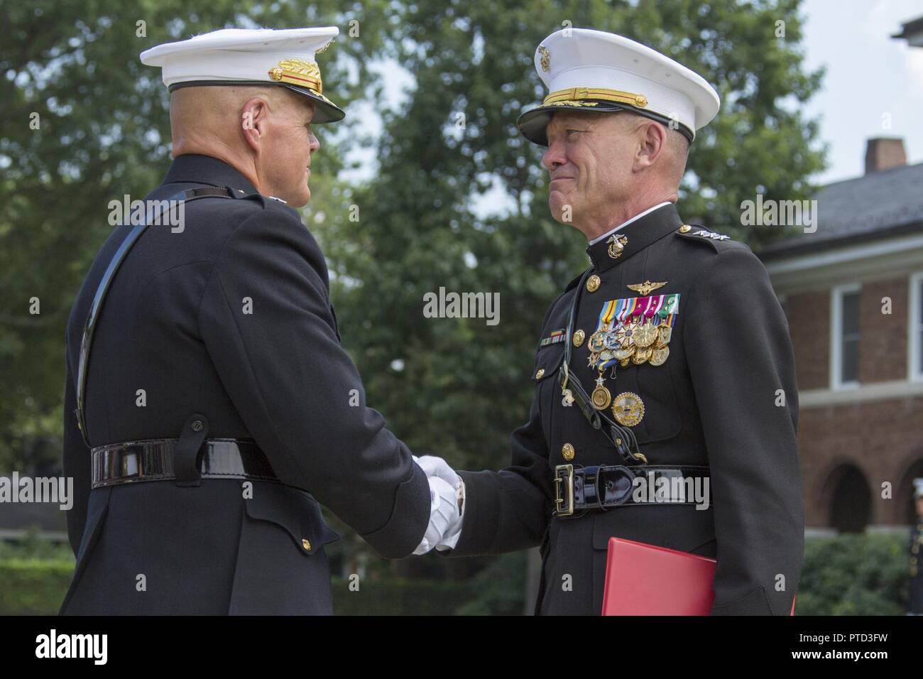 Commandant of the Marine Corps Gen. Robert B. Neller, left, shakes ...