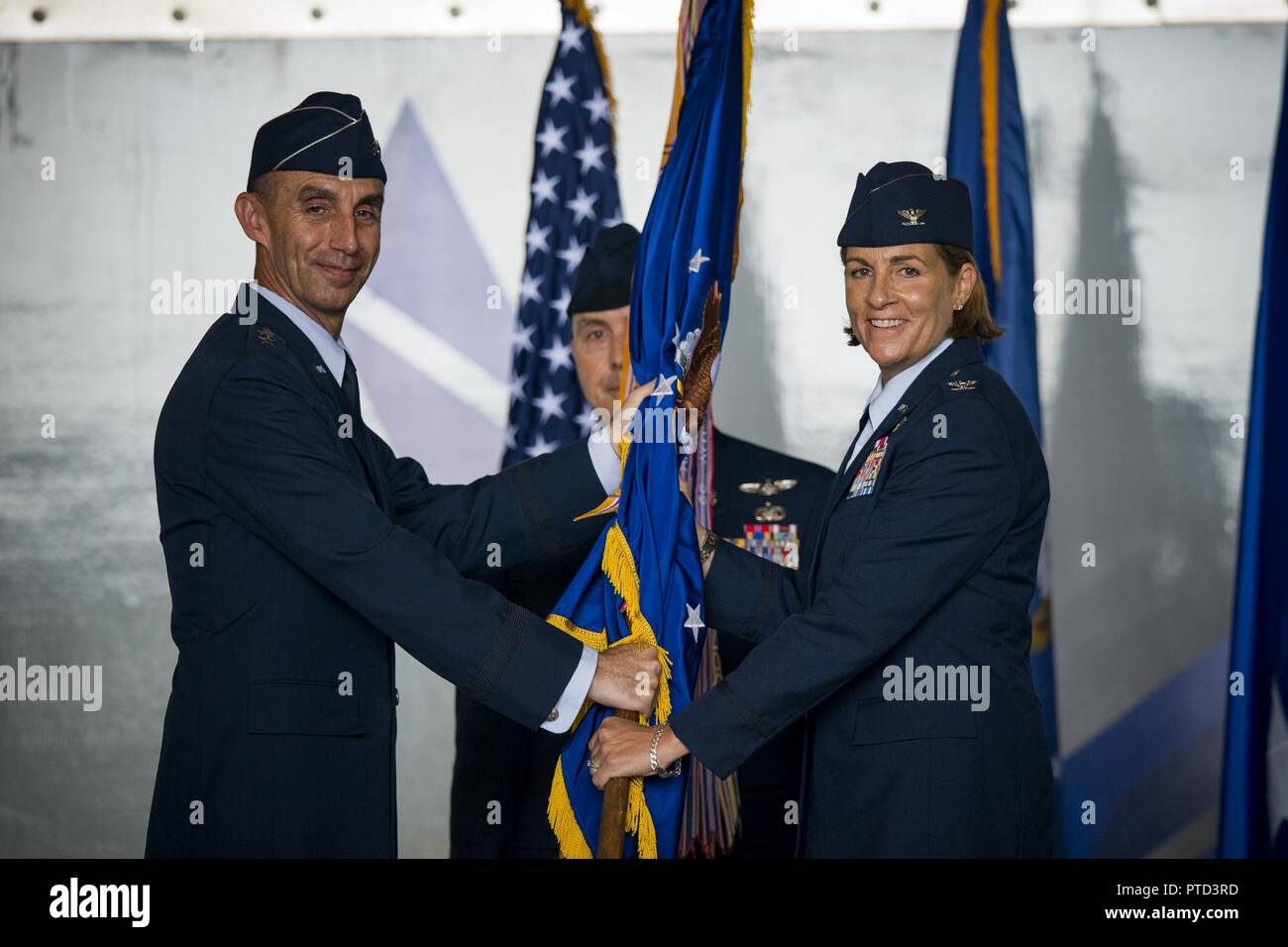 Maj. Gen. Scott J. Zobrist, left, 9th Air Force commander, hands the ...