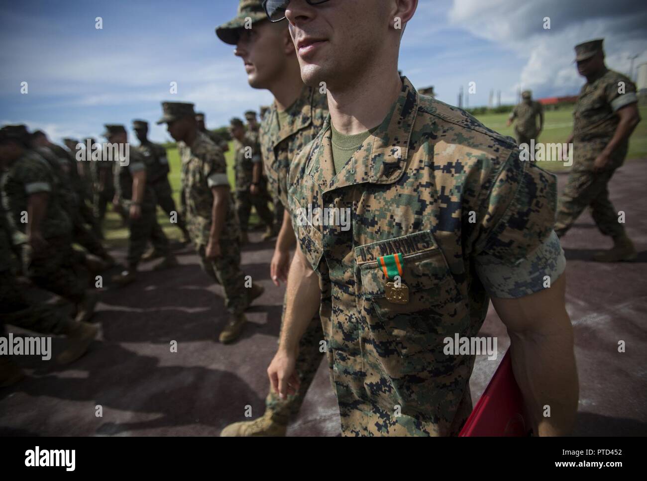 U.S. Marine Cpl. Christopher Ehms receives a Navy Achievement Medal ...