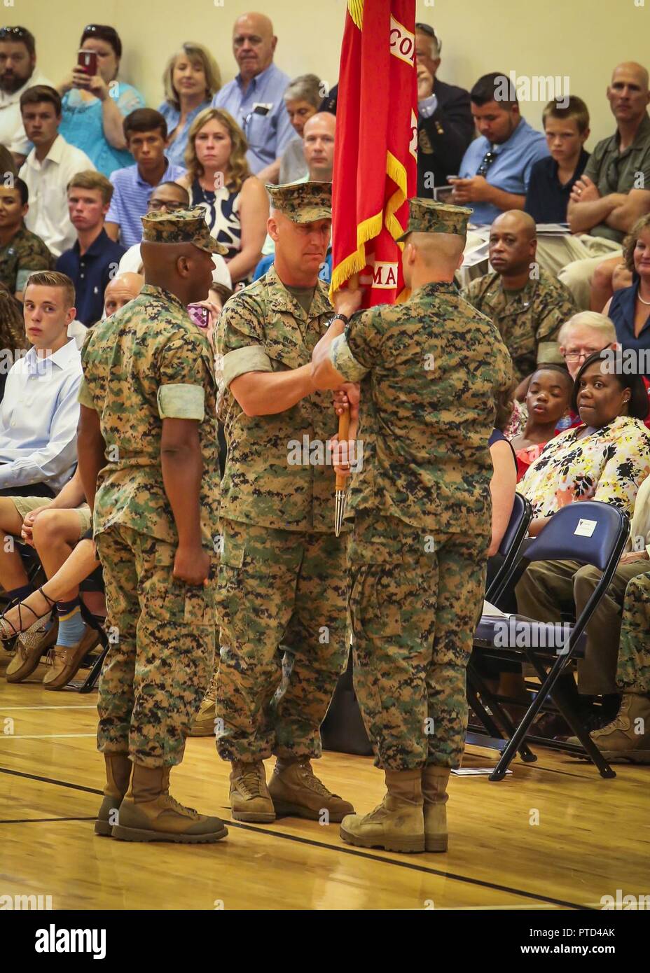Col. Peter D. Buck (center) transfers the battle standard to Col ...