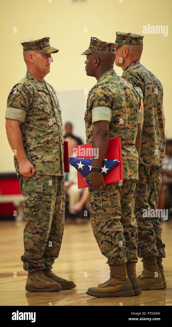 Col. Peter D. Buck (left) receives awards from Maj. Gen. Matthew G ...