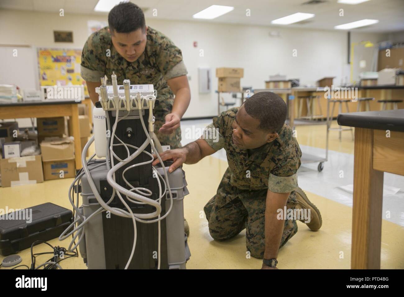 Petty Officer 2nd Class John Lagmay (left) and Petty Officer 3rd Class ...