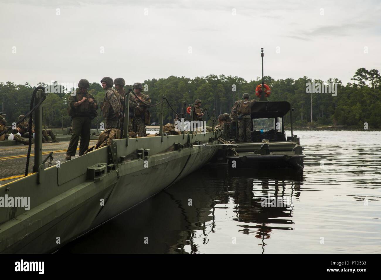 Marines prepare the seven-bay raft system to receive tactical vehicles ...
