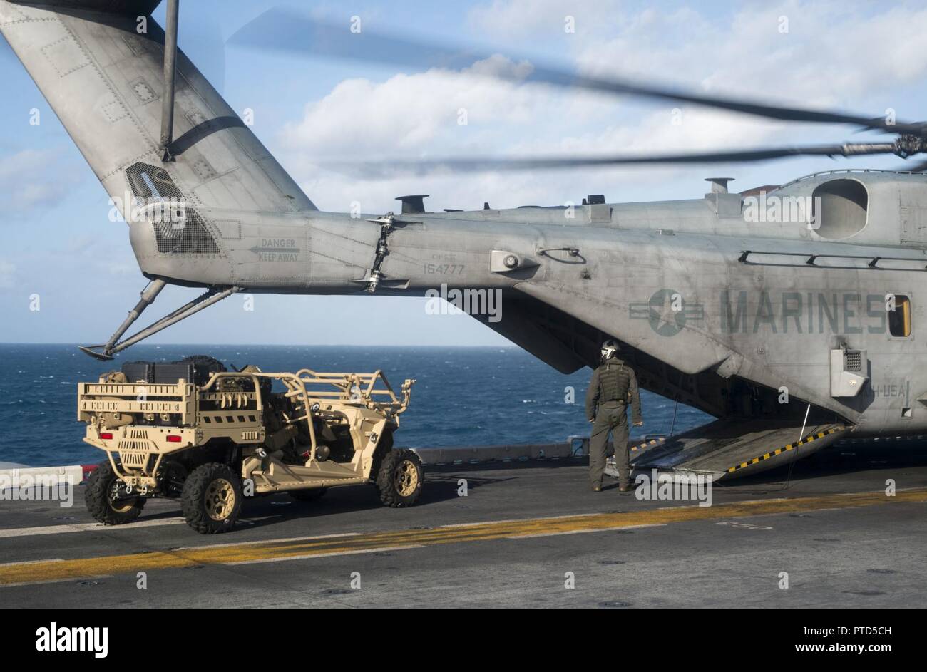 CORAL SEA (July 12, 2017) Combat Cargo Marines load a C2 MRZR ...