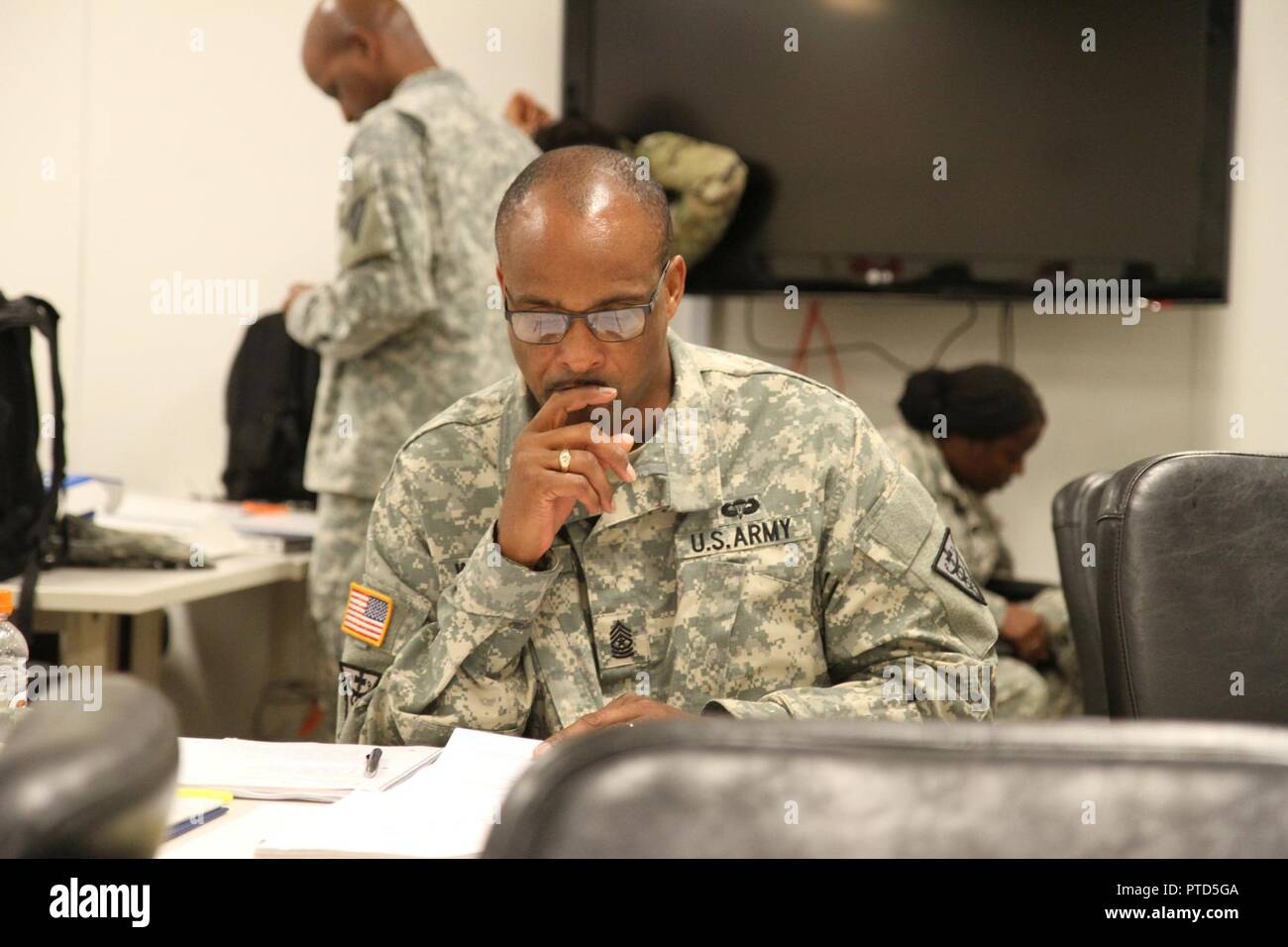 Command Sgt. Maj. Daniel Williams looks over the tactical standing ...