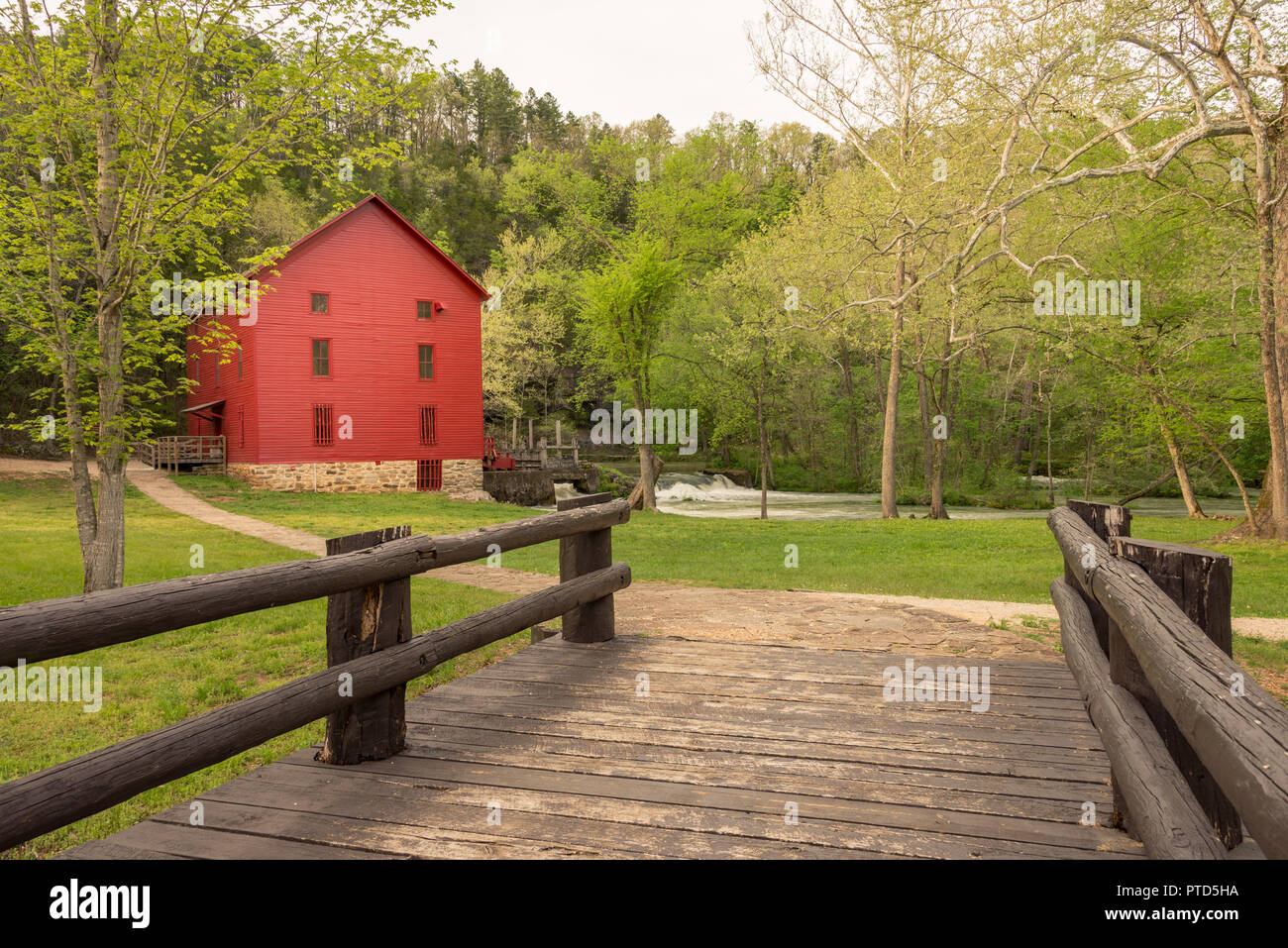 Red Mill Barn at the end of a wooden bridge, old grist mill, farm ...
