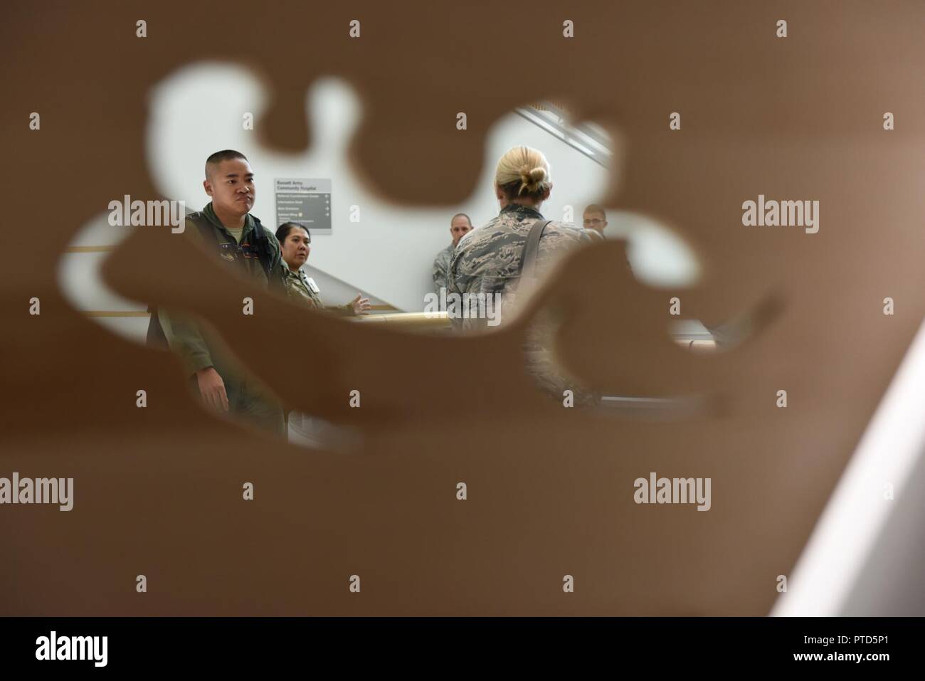 Members of the 126th Medical Group, as seen through a decorative cut ...