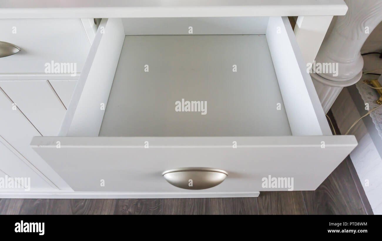 background empty modern white wooden cabinet drawer that is open and is ...