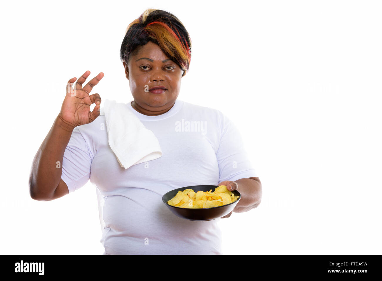 Studio shot of fat black African woman holding bowl of potato ch Stock ...