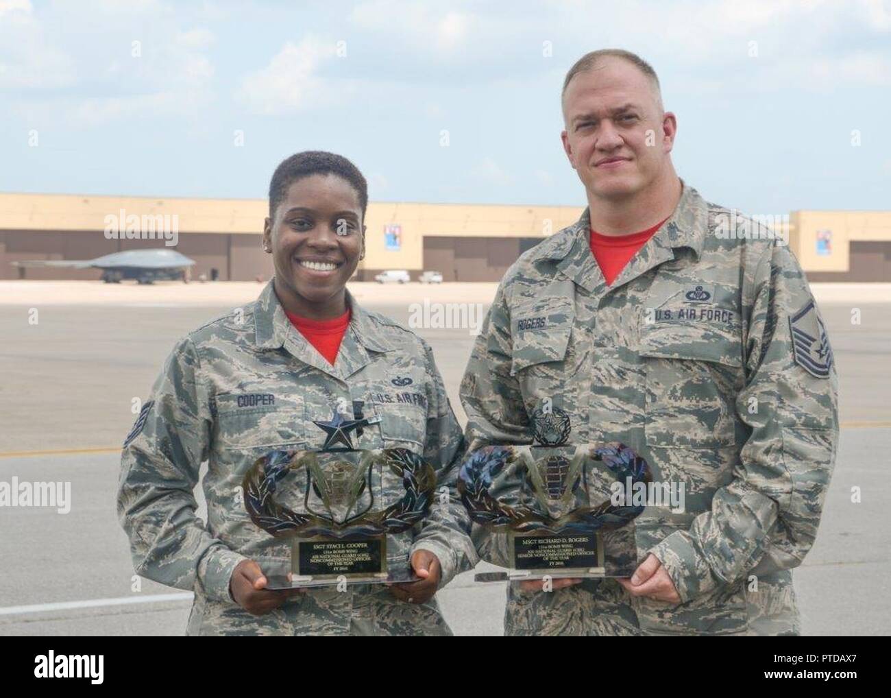Tech. Sgt. Staci Cooper and Master Sgt. Richard Rogers proudly display ...