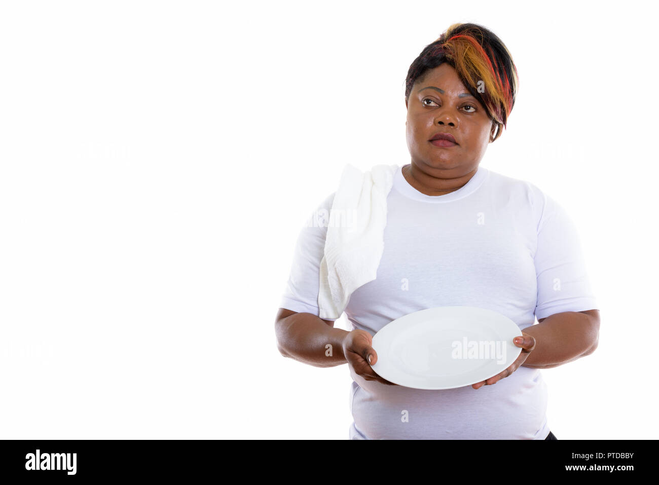 Studio shot of fat black African woman thinking while holding em Stock ...