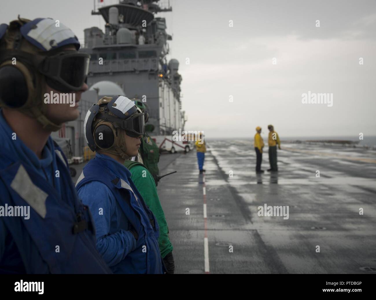 ATLANTIC OCEAN (July 10, 2017) Sailors observe flight deck operations ...