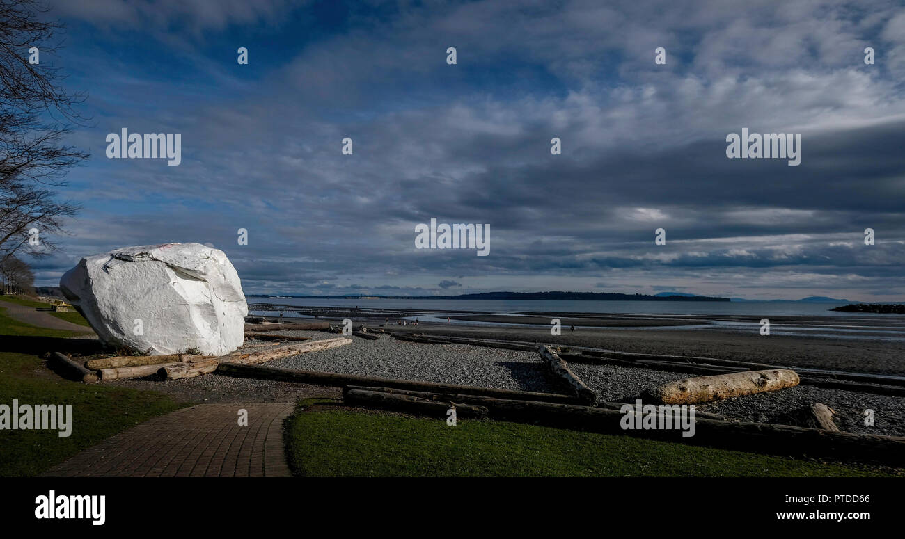 A HUGE white rock, stoic and strong, on the beach of White Rock Stock ...