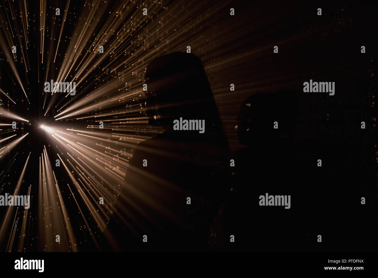 Light abstract projection. Colorful light rays. The silhouette of ...