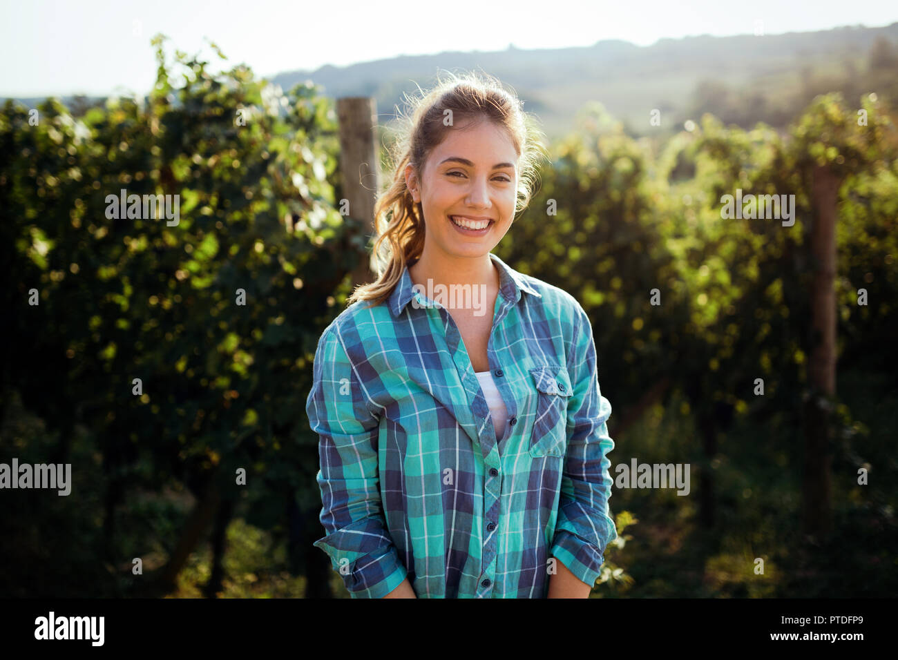 Woman winemaker with grapes in a vineyard Stock Photo - Alamy