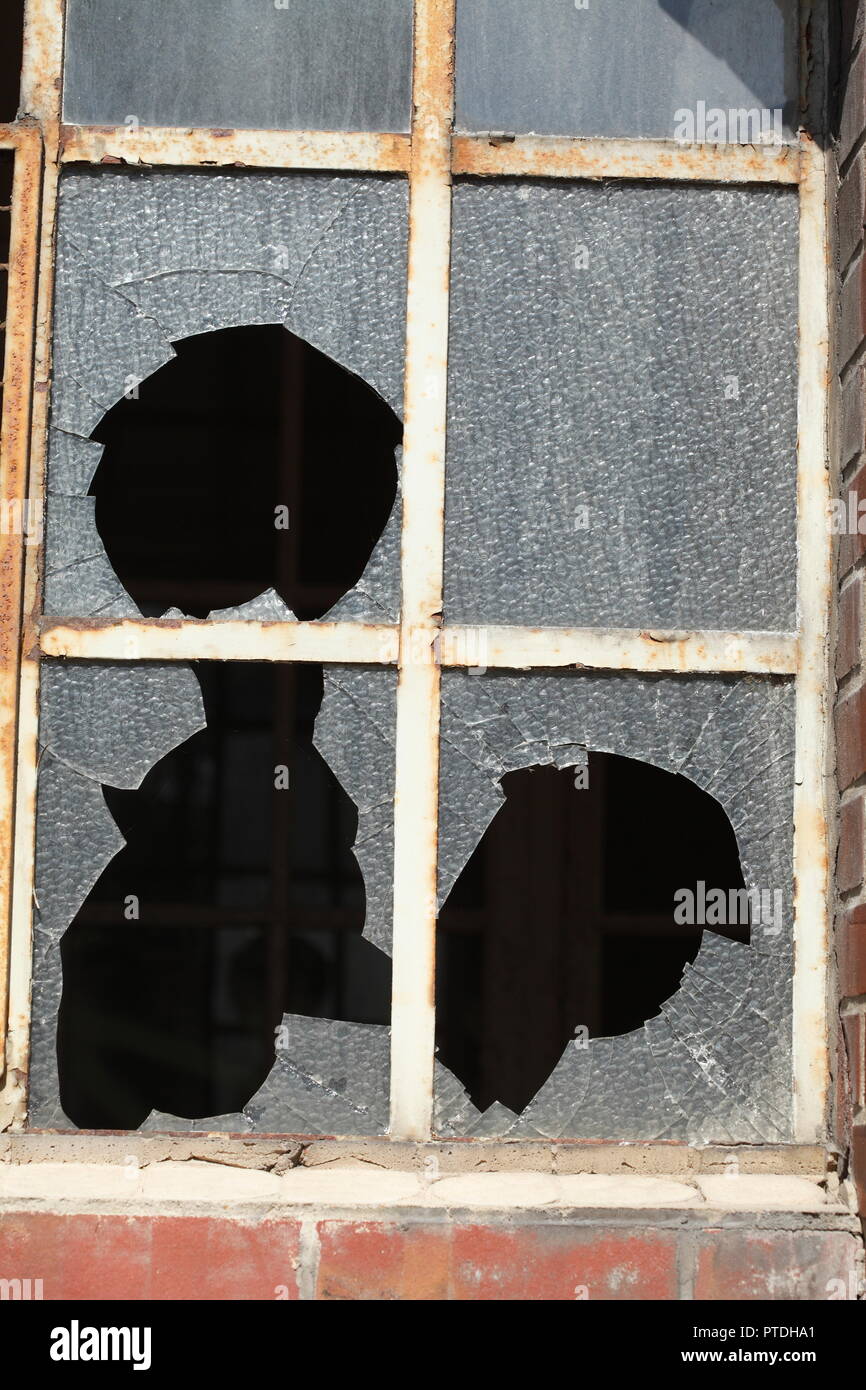 Fragmented glass, old broken window Stock Photo - Alamy