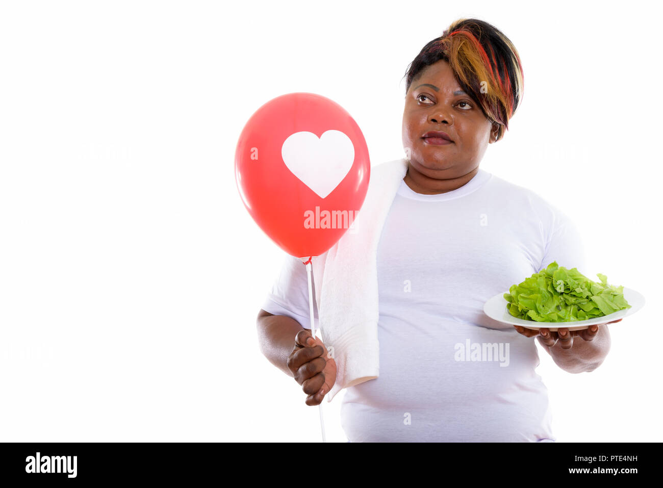 Studio shot of fat black African woman thinking while holding le Stock ...