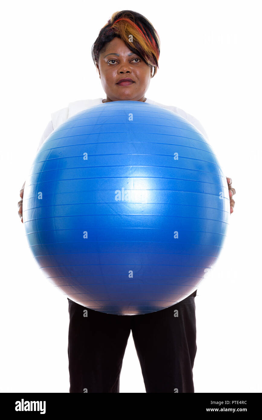 Studio shot of fat black African woman thinking and standing whi Stock ...