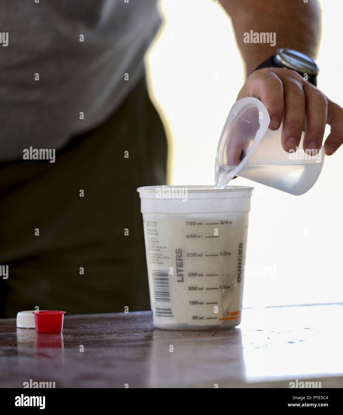An FBI Special Agent Bomb Technician prepares a homemade explosive ...