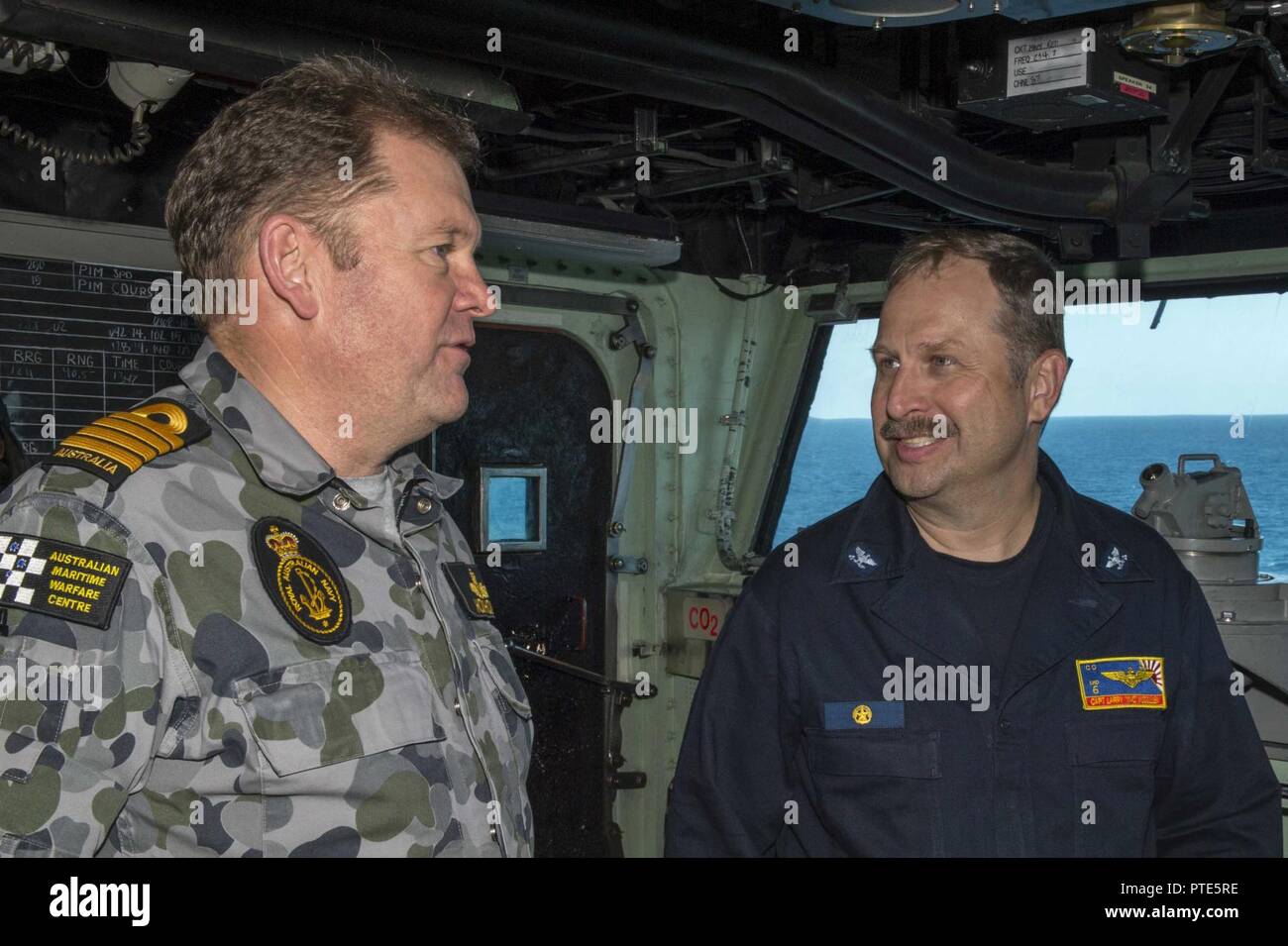 CORAL SEA (July 14, 2017) Capt. Larry McCullen (right), commanding ...