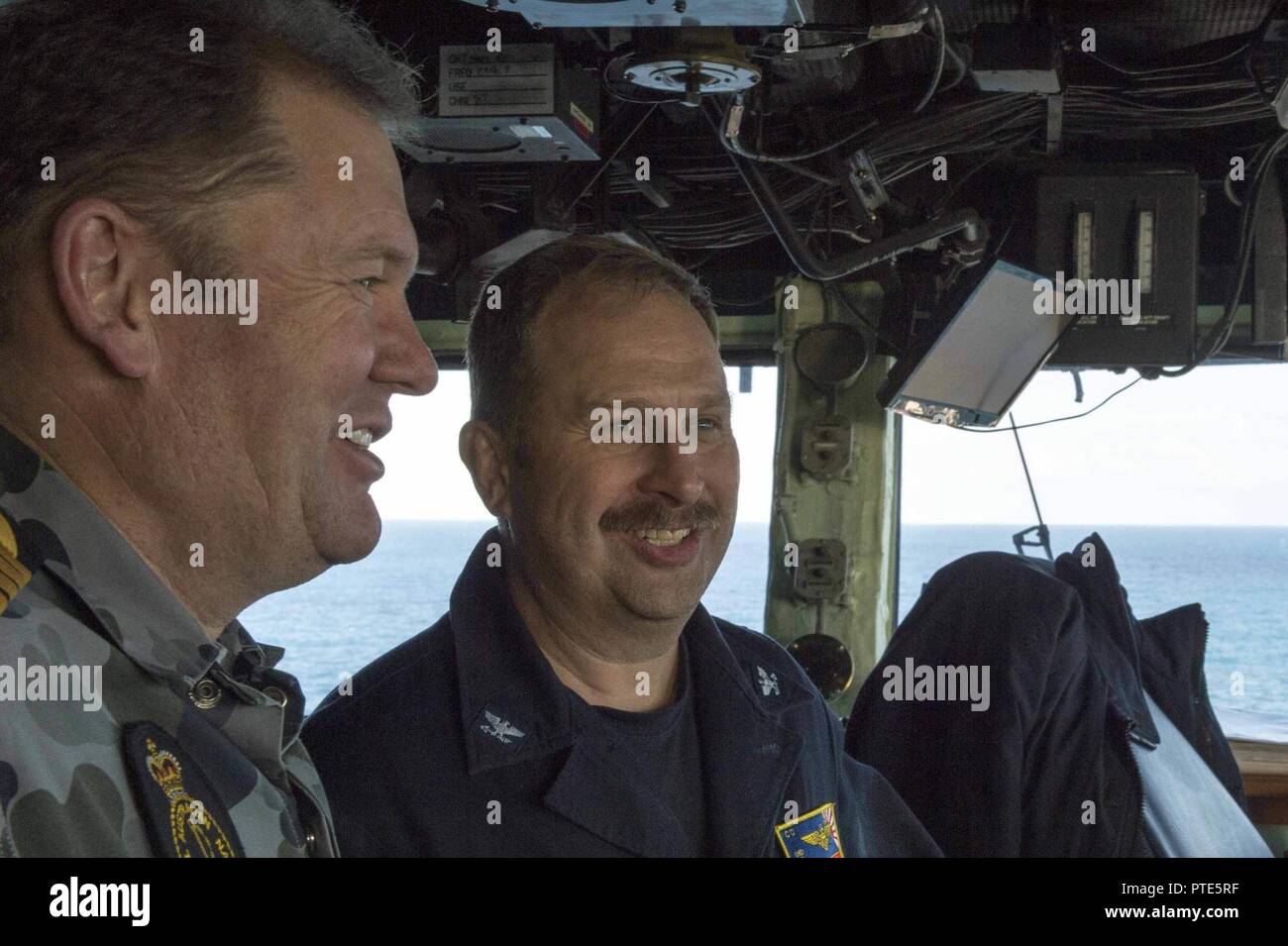 CORAL SEA (July 14, 2017) Capt. Larry McCullen (right), commanding ...
