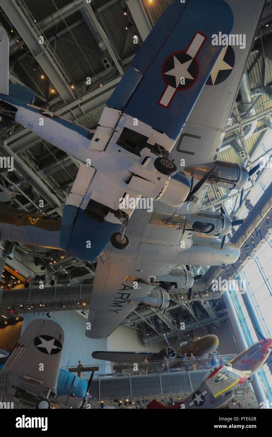 Exhibits of WWII planes suspend from the ceiling displaying a showcase ...