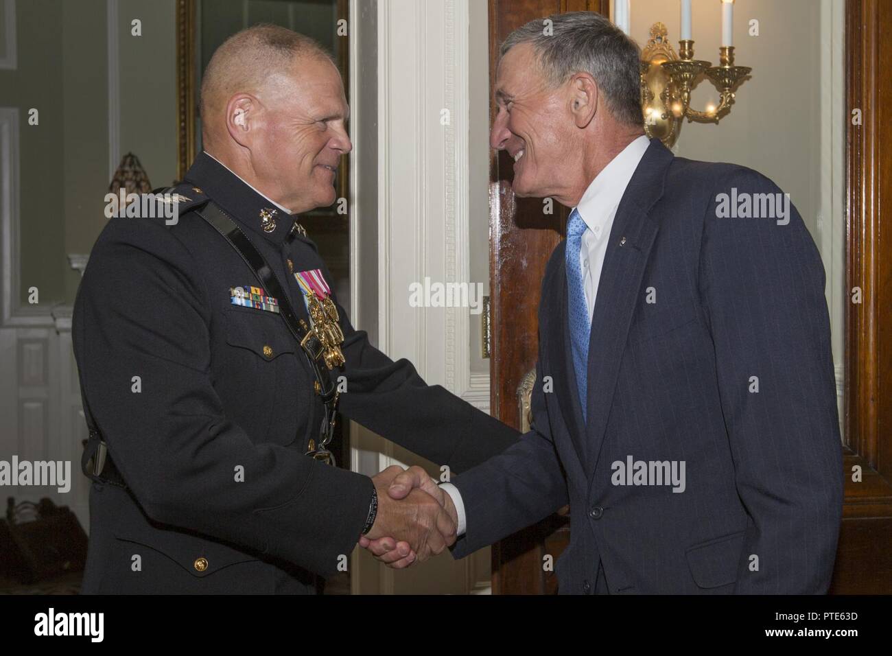 Commandant of the Marine Corps Gen. Robert B. Neller, left, shakes ...