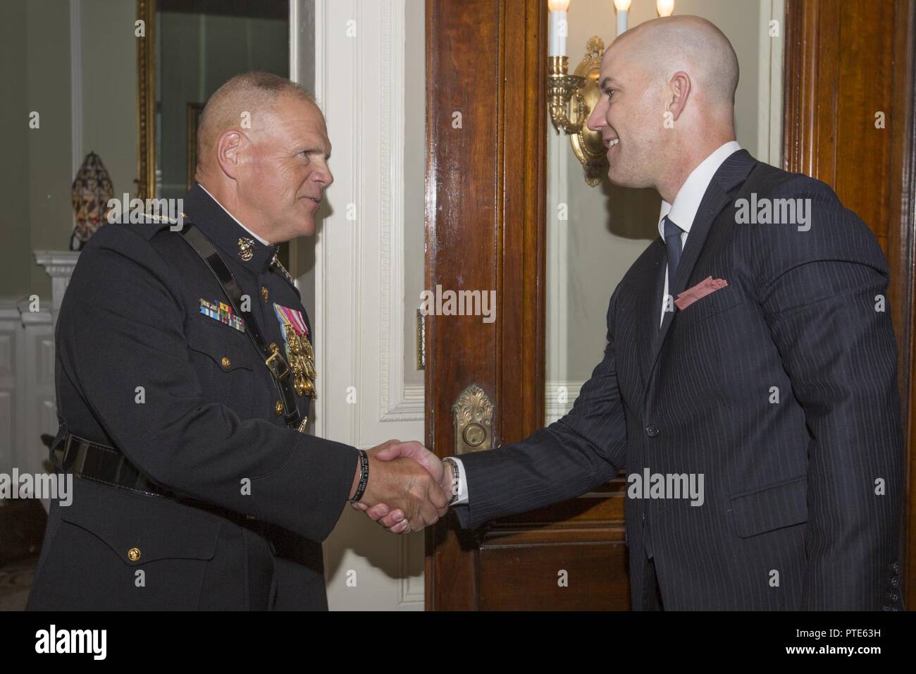 Commandant of the Marine Corps Gen. Robert B. Neller, left, shakes ...