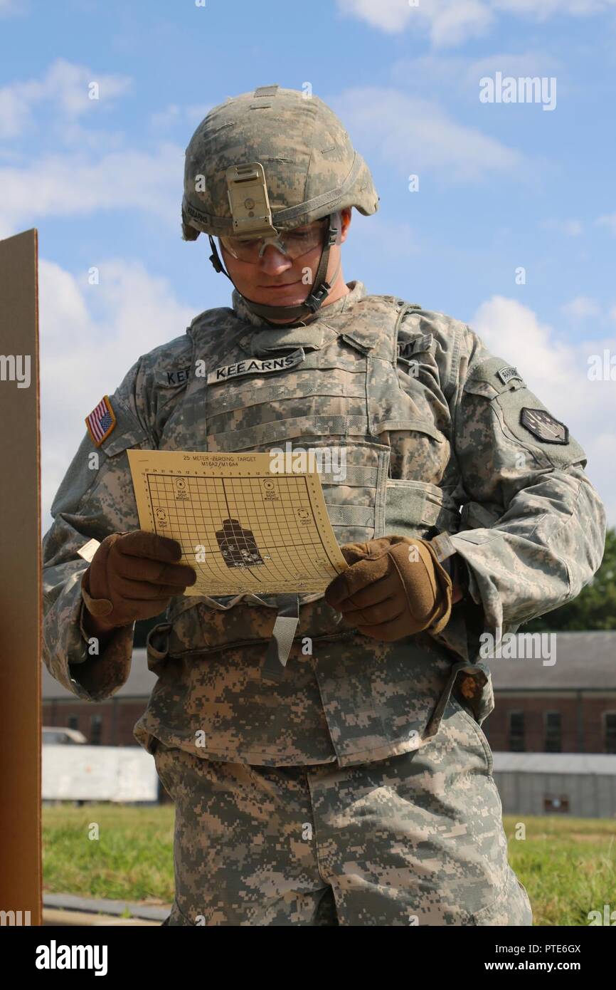 U.S. Army Spc. Thomas Keearns, 48th Chemical Brigade, looks at his ...