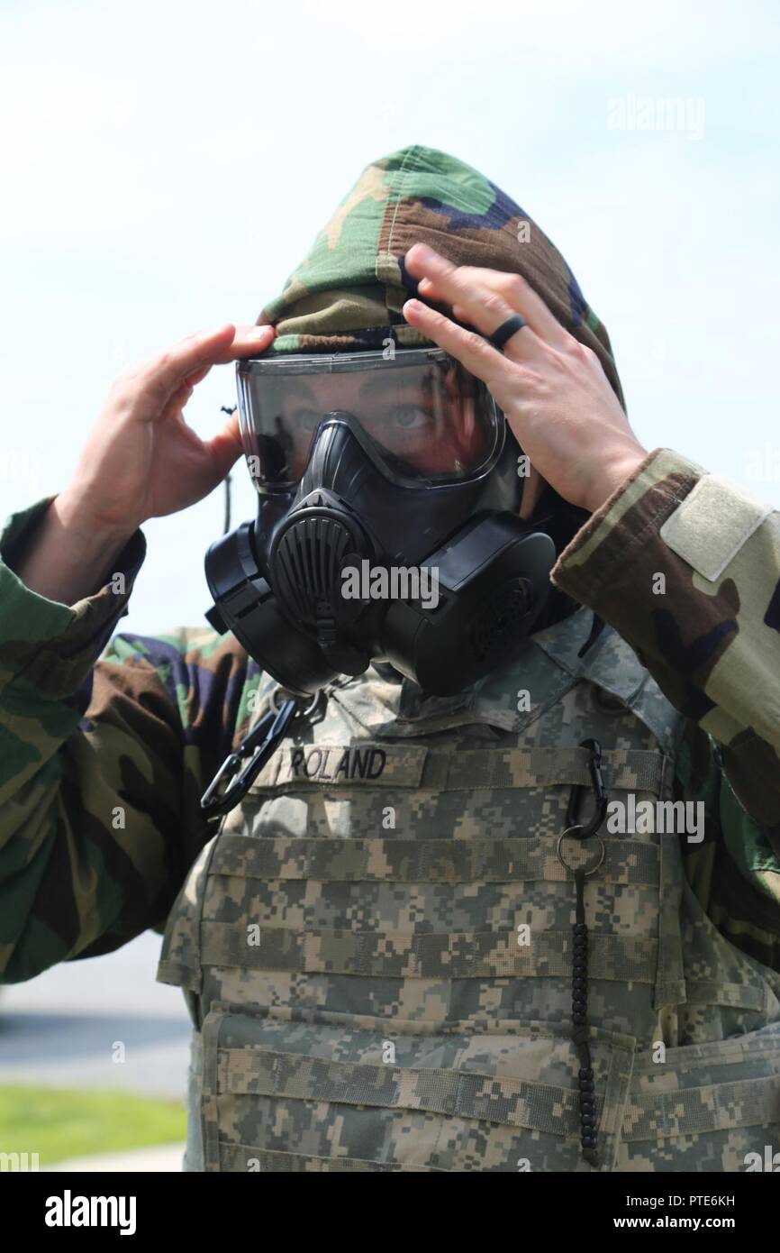 U.S. Army Sgt. Andrew Roland, 71st Ordnance Group (EOD), puts on his ...