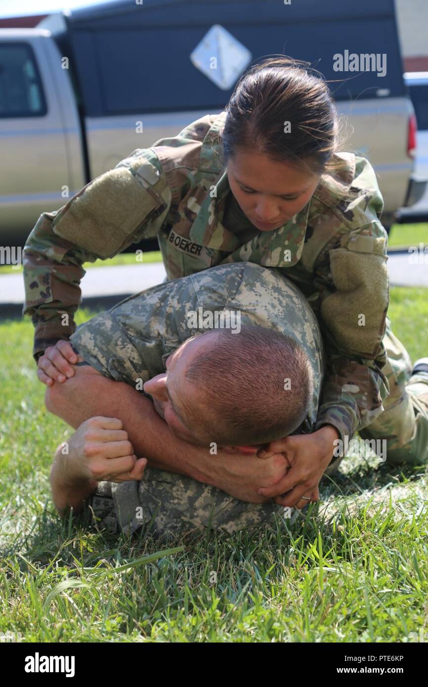 U.S. Army Pfc. Jessellie Boeker, 20th CBRNE Command, performs various combatives moves during a ...