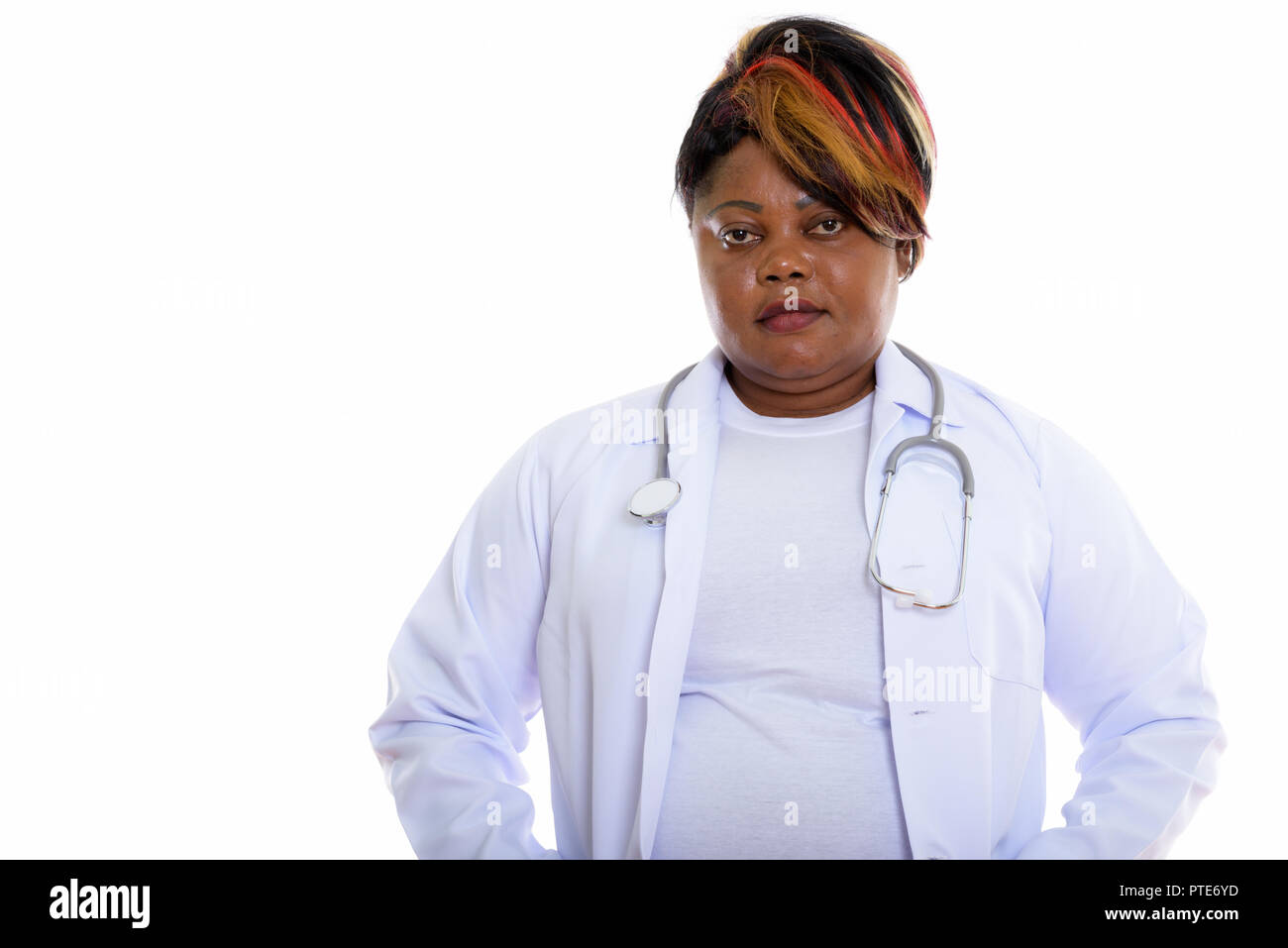 Studio shot of fat black African woman doctor Stock Photo - Alamy