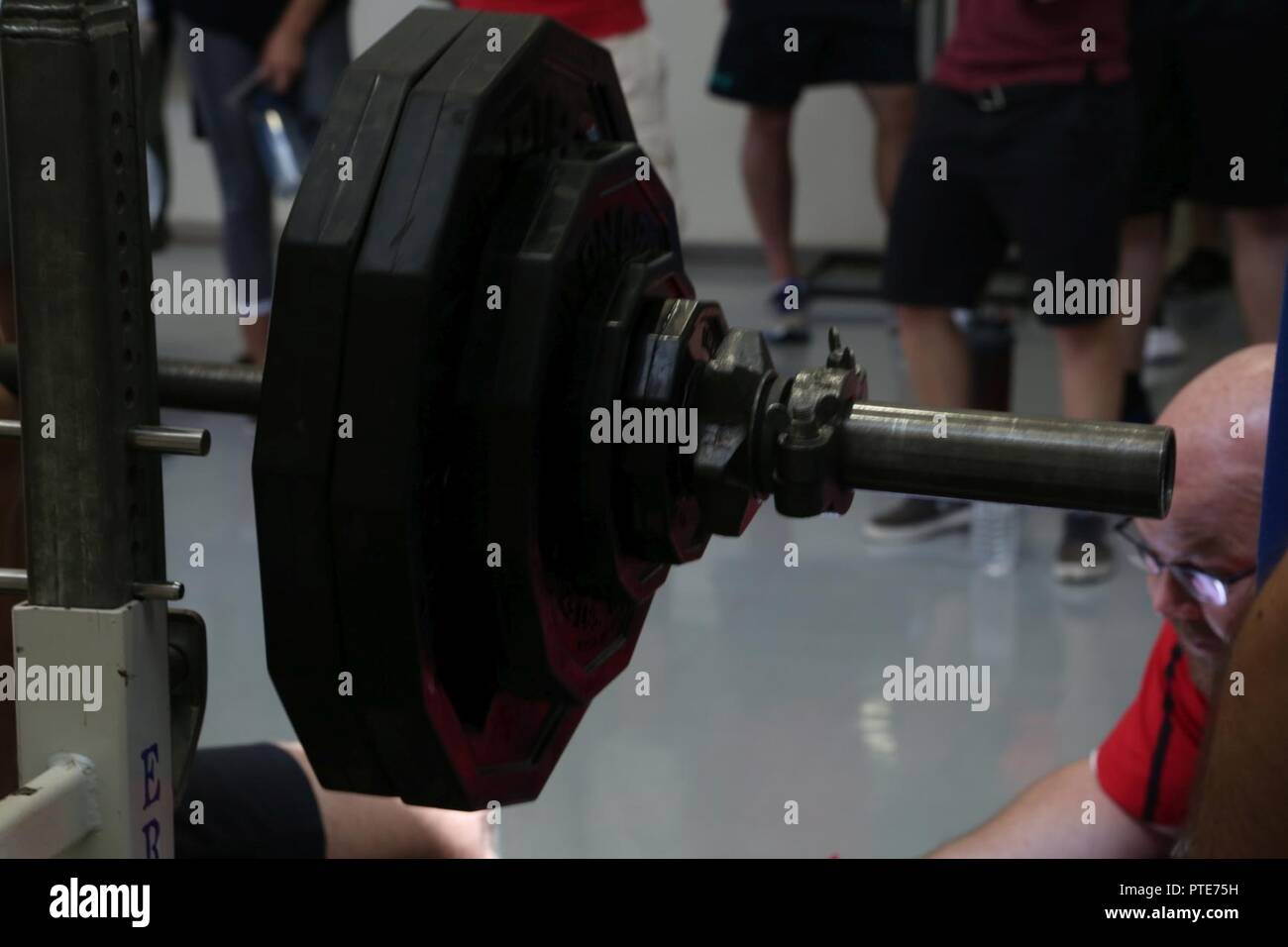 CAMP FOSTER, OKINAWA, Japan – Weights are secured to the bar for the ...