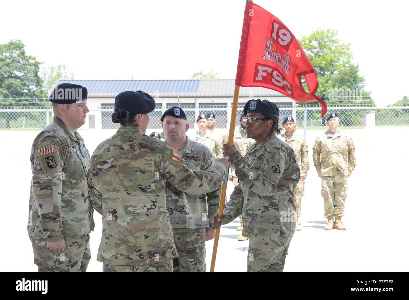 Outgoing Commander CPT Jennifer Williams hands the guidon to LTC Esther ...