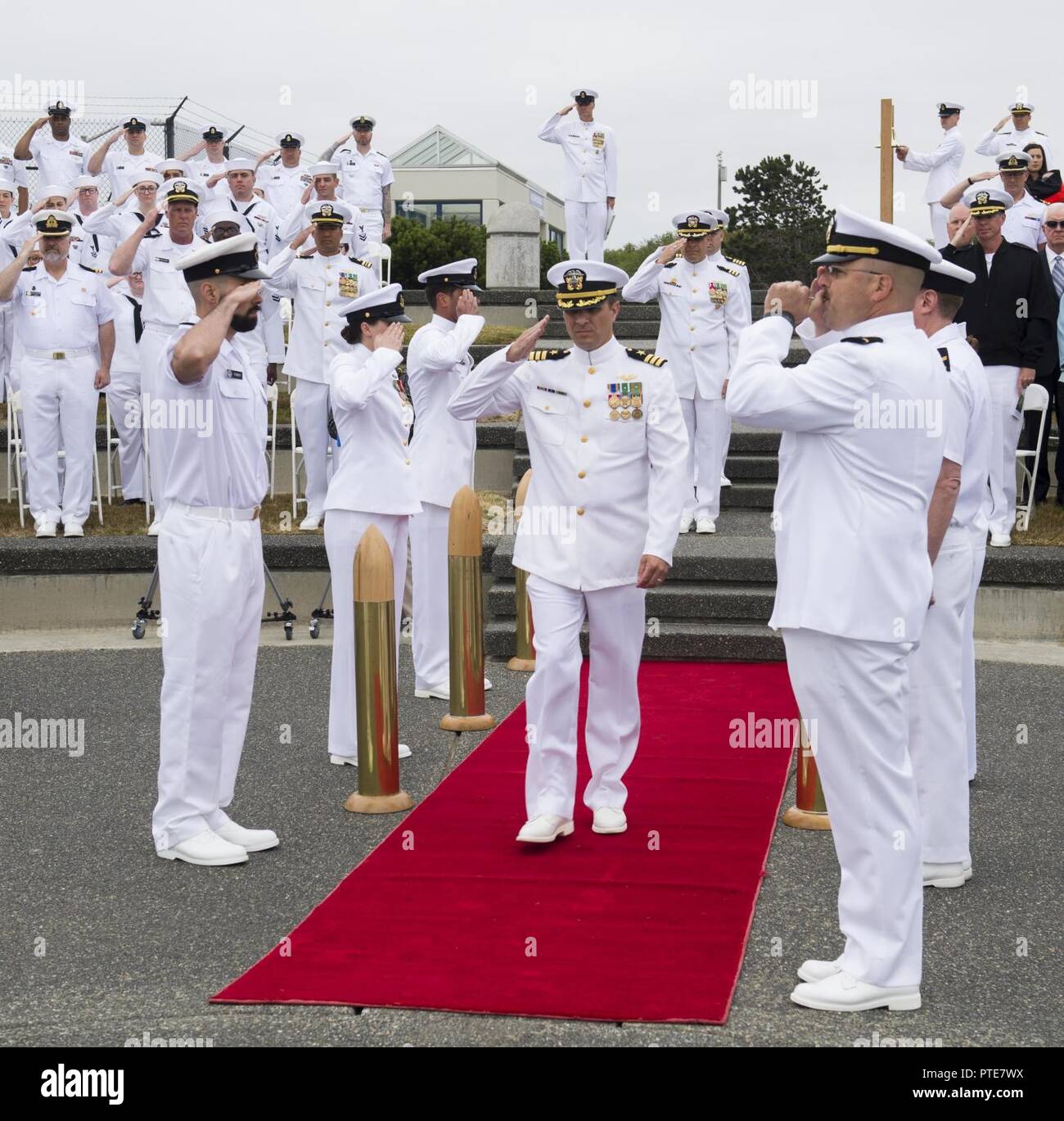 OAK HARBOR, Wash. (July 13, 2017) Cmdr. Robert Burns salutes the ...