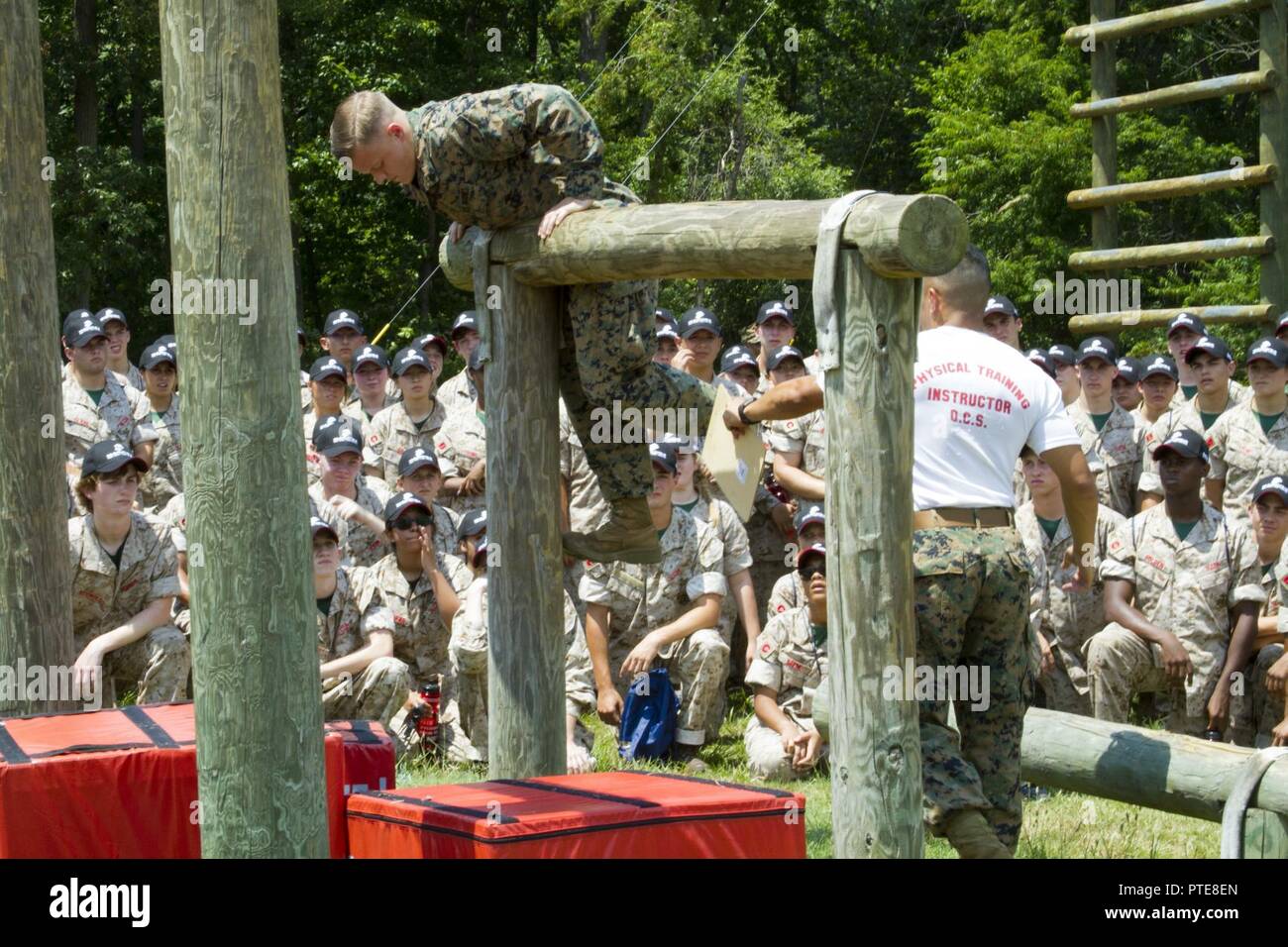 Physical Training Instructors demonstrate the proper way to maneuver ...